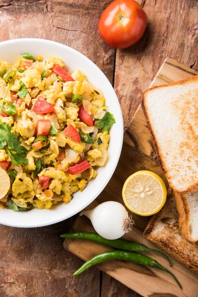 Masala Anda Bhurji of egg bhurji or Spicy scrambled eggs with bread ...