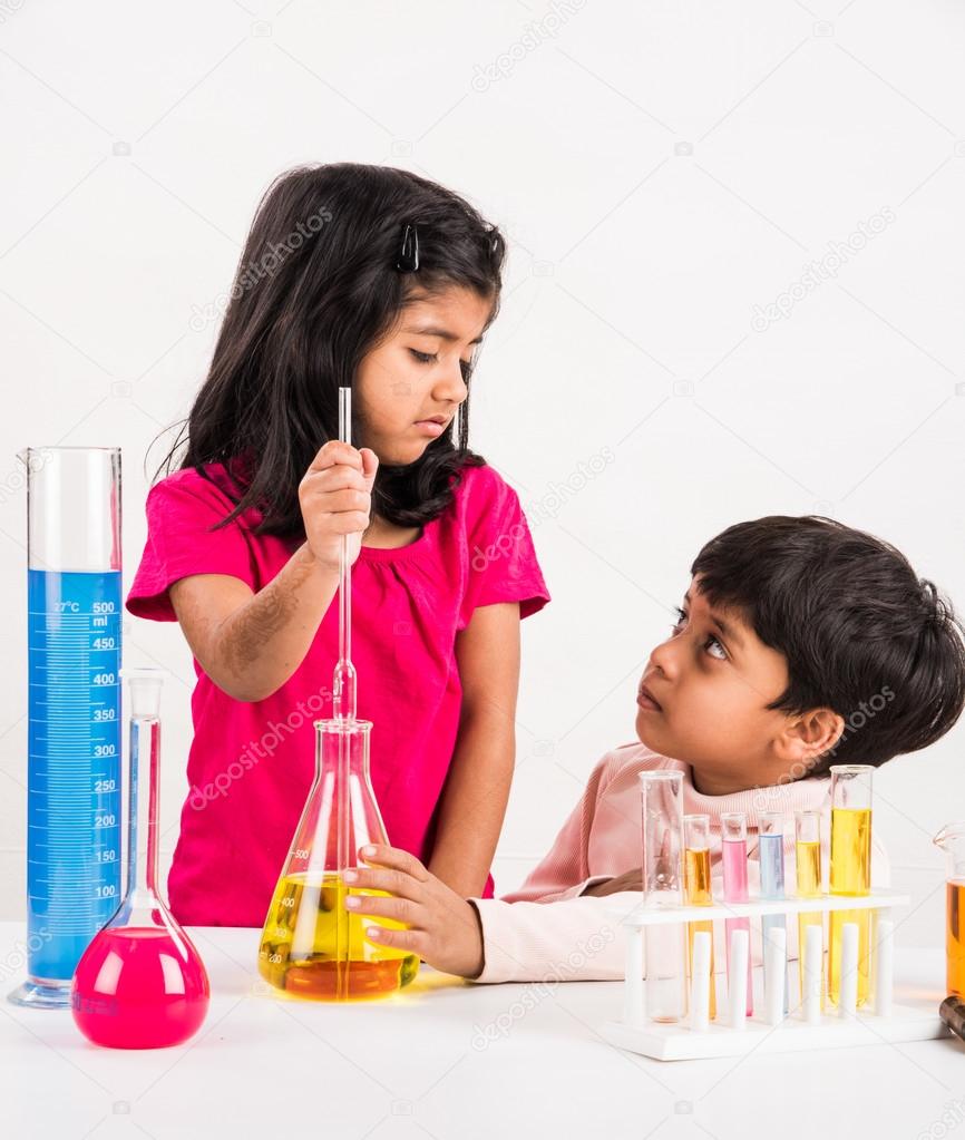 4 year old indian boy and girl doing science experiment, science ...