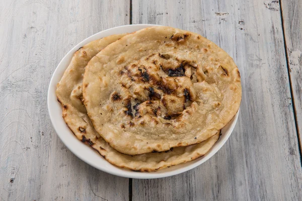 Indian special bread also known as butter roti, chapati, naan, kulcha, paratha, tanduri roti ...