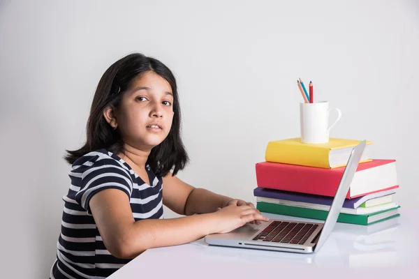 Cute little indian girl studying on laptop, asian small girl studying ...
