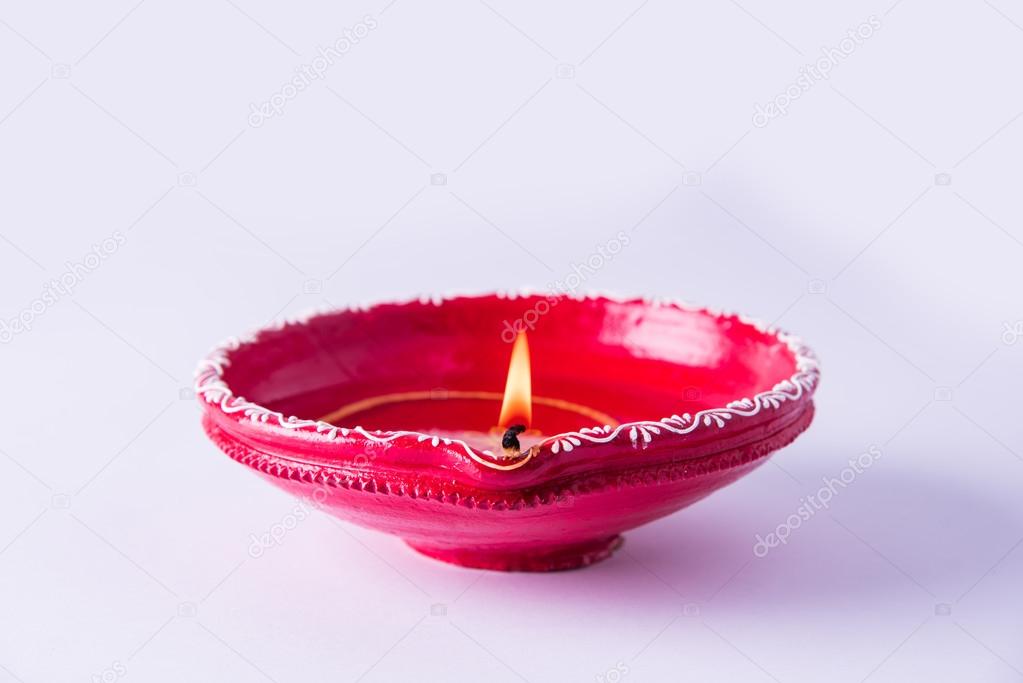 Single Clay diya lamp lit during diwali festival. happy diwali ...