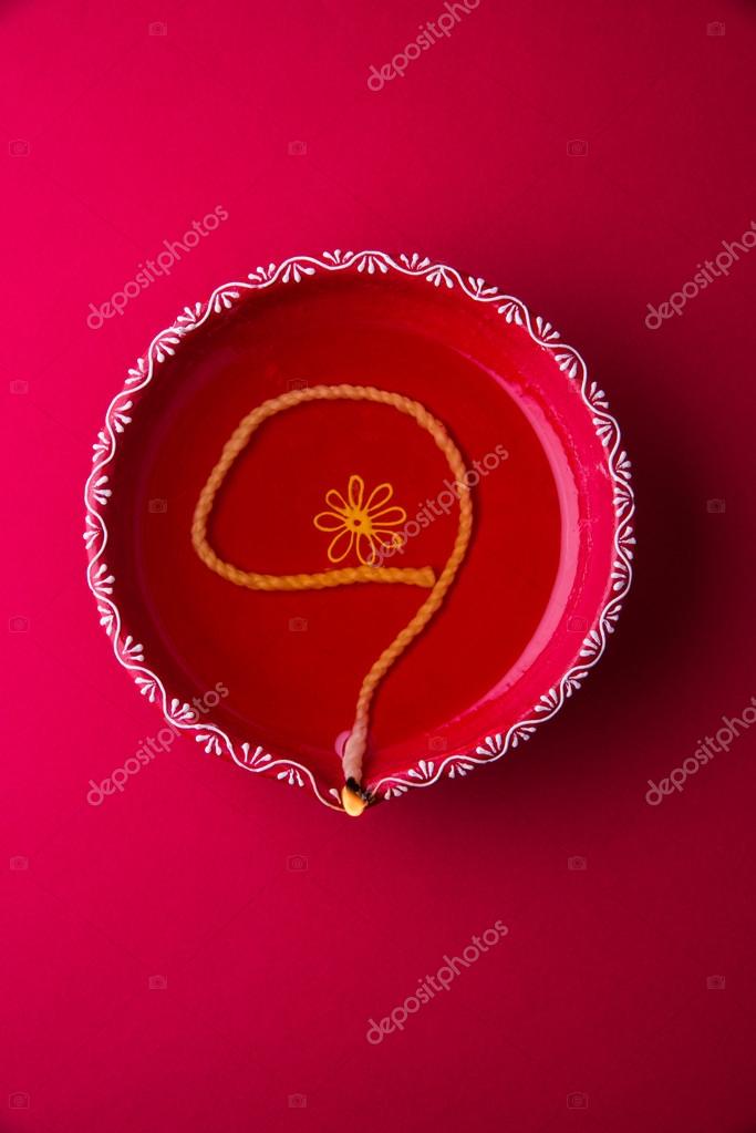 Single Clay diya lamp lit during diwali festival. happy diwali ...