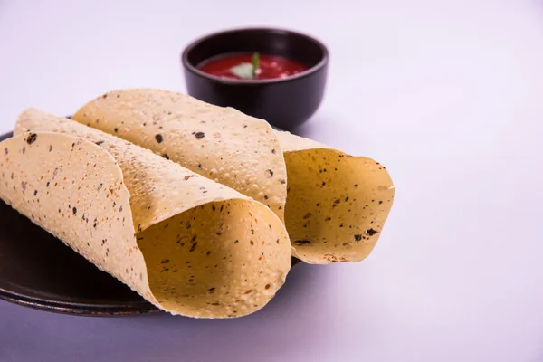 Rosted papad or roll papad, indian traditional started food or side ...