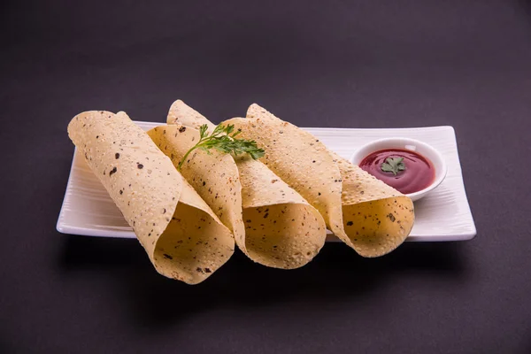 Rosted papad or roll papad, indian traditional started food or side ...