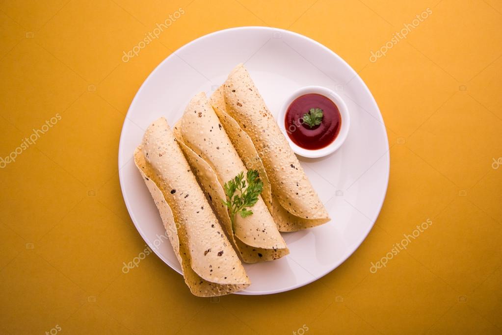 Rosted papad or roll papad, indian traditional started food or side ...
