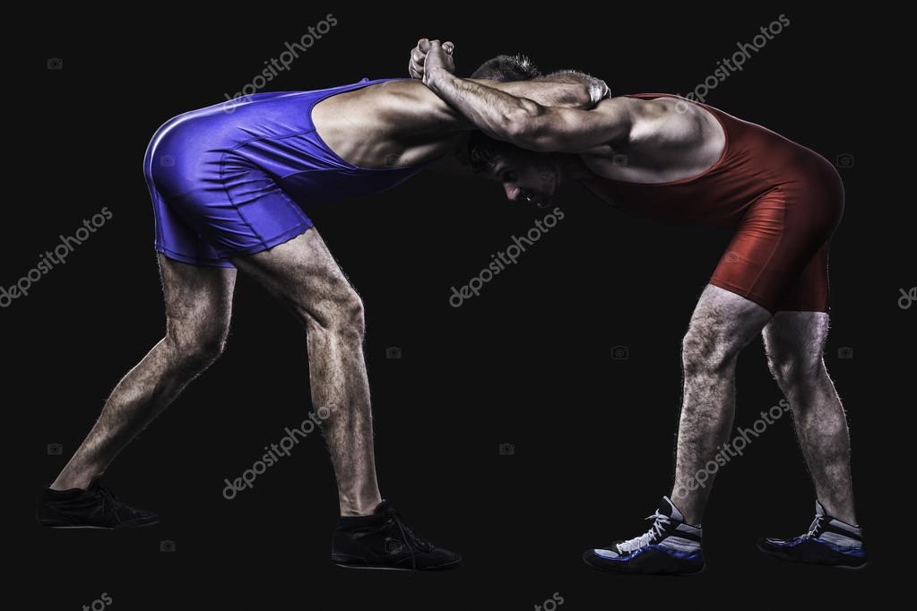 Two wrestlers holding each other in stand isolated Stock Photo by ...