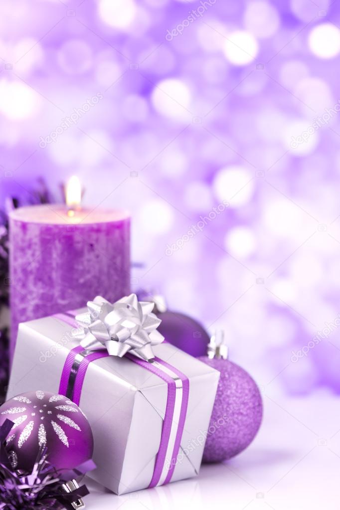 Purple Christmas scene with baubles, gift and candles — Stock Photo ...