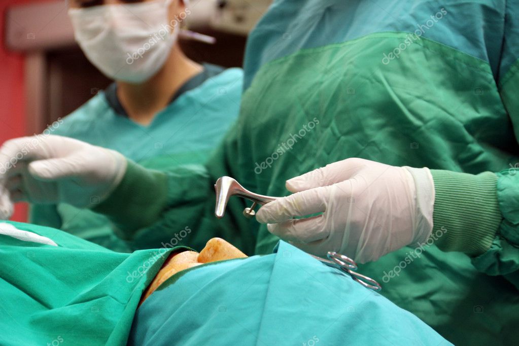Plastic Surgery team operating in a surgical room — Stock Photo ...
