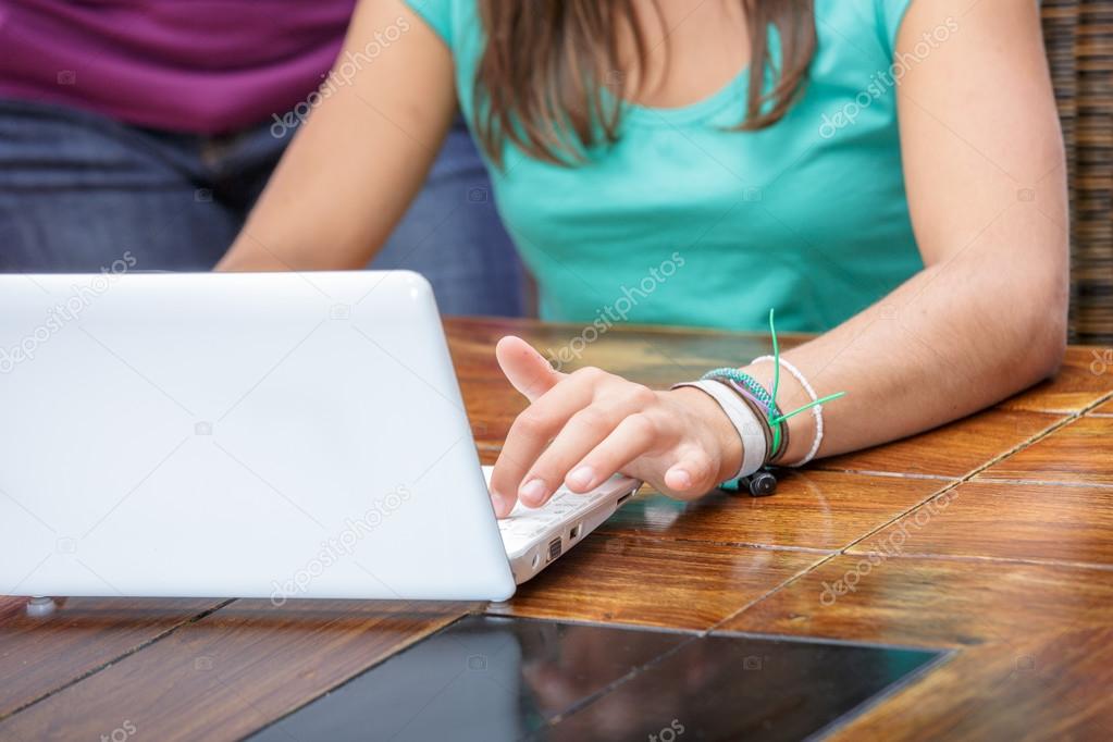 Pretty student girl doing homework at home with a laptop Stock Photo by ...