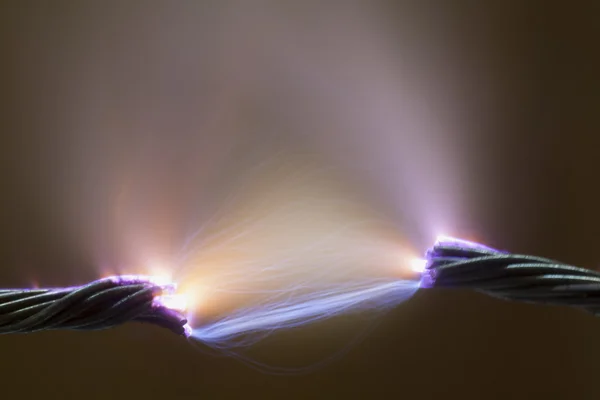 Electrical spark between two insulated copper wires Stock Photo by ...