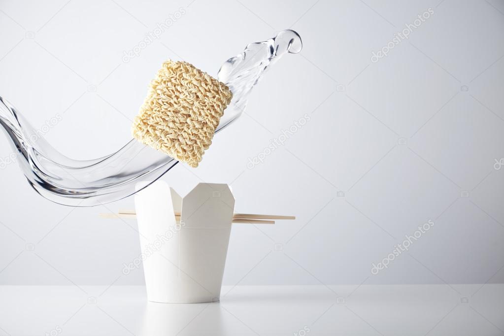 Water splash flies across brick of noodles — Stock Photo © derepente ...