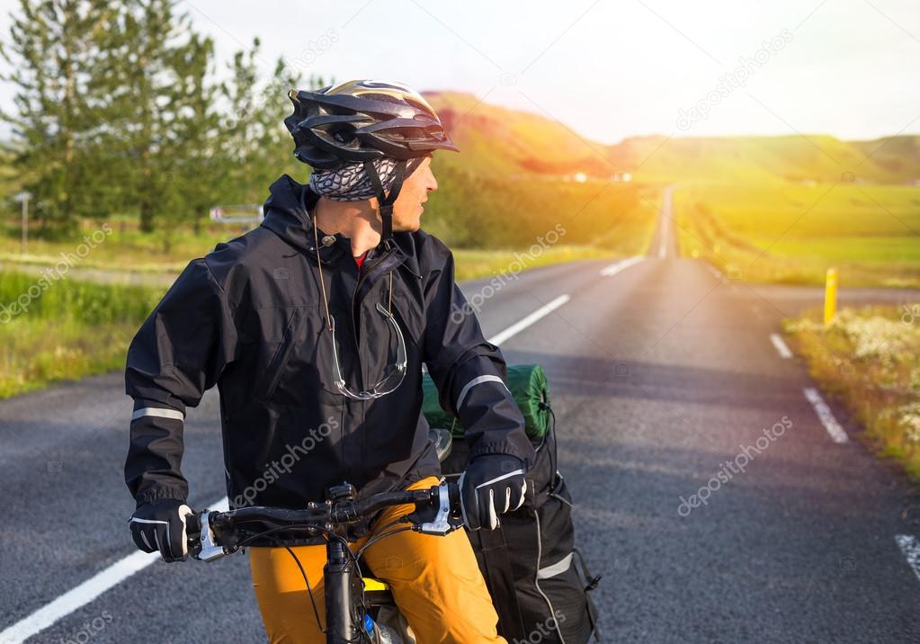 Happy biker on backdrop of mountains in Iceland — Stock Photo © lko ...