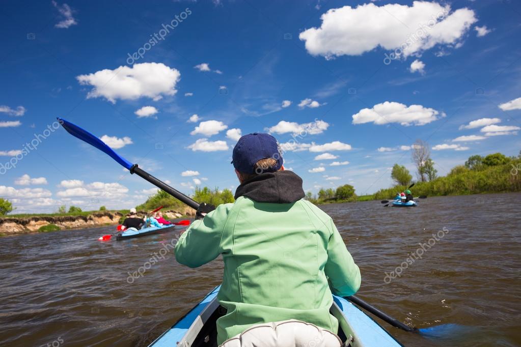 Young people are kayaking on a river in beautiful nature Stock Photo by ...