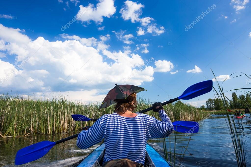 Young people are kayaking on a river in beautiful nature Stock Photo by ...