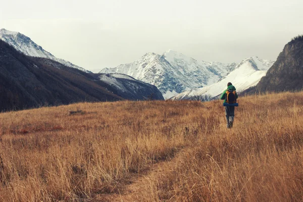 Backpacker go into the mountains. Happy travel concept. Mountain ...