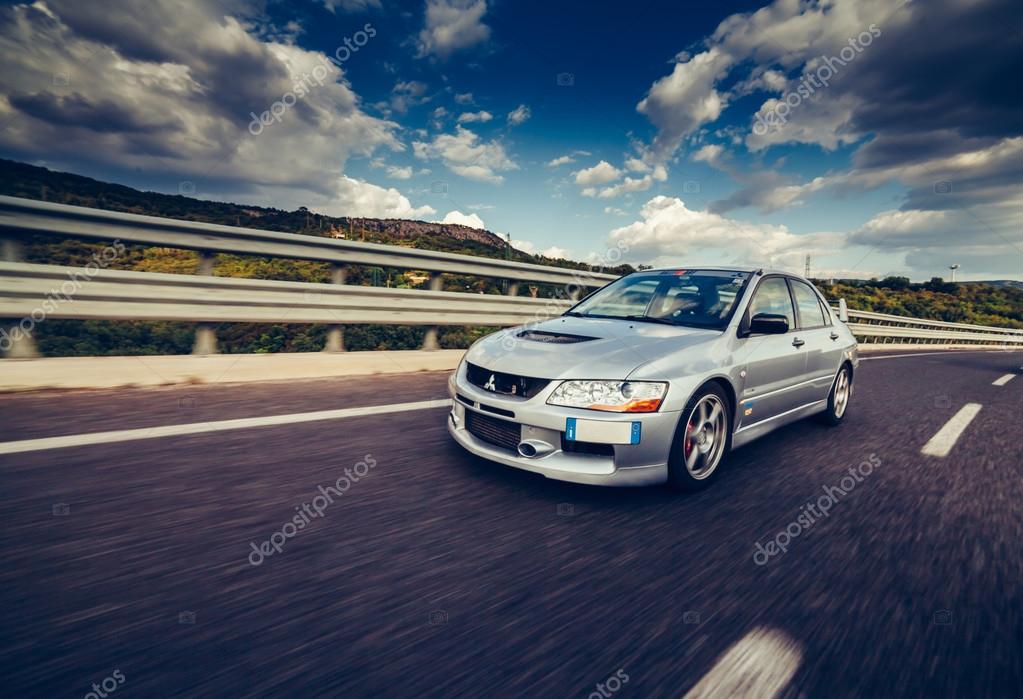 Mitsubishi EVO 8 on highway – Stock Editorial Photo © bluebe #114487418