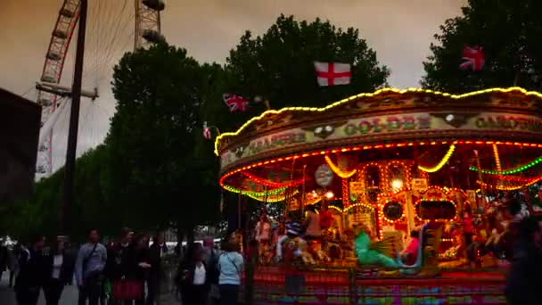 LONDON: Amusement park carousel with beautifully painted wooden horses ...