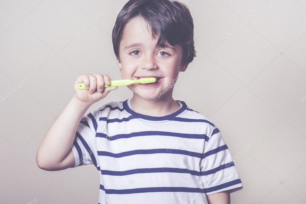 Happy child brushes his teeth ⬇ Stock Photo, Image by © esthermm #87215298