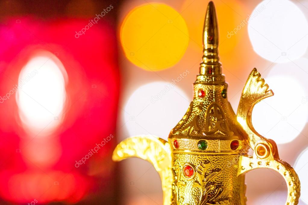 Golden Arabic Coffee pot in colorful illuminated background. Stock ...