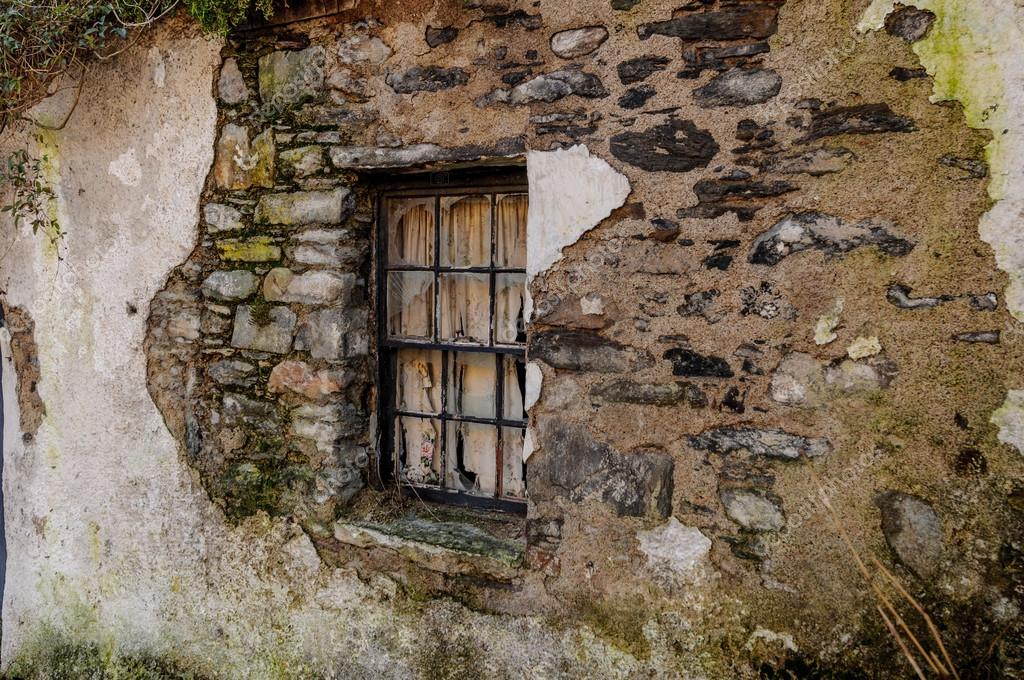 Broken window of a derelect cottage Stock Photo by ©Cornfield 111515670
