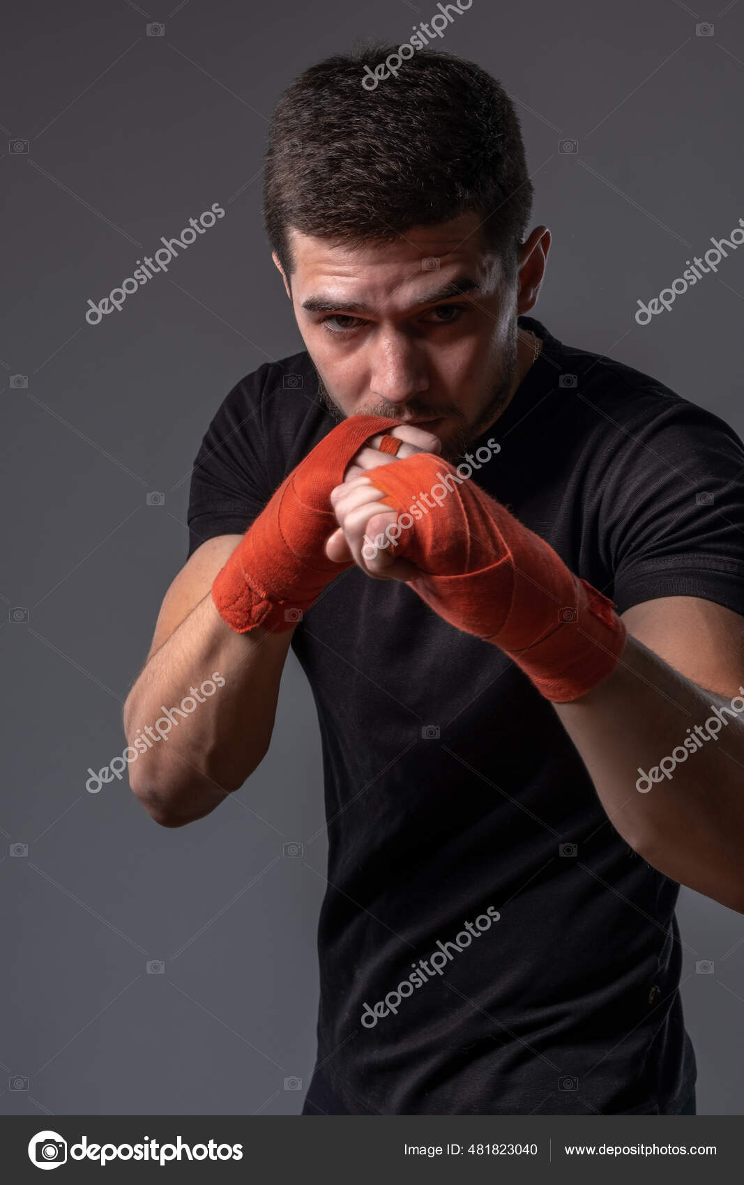 Sporty man with hands wraps standing in orthodox fighting stance Stock ...