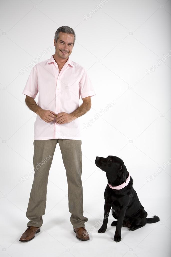 Man standing with Labrador dog Stock Photo by ©Focusarg 93430422