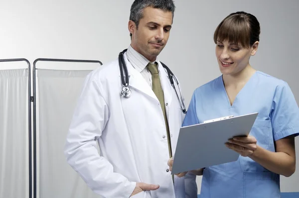 A group of young doctors, mixed race. In the corridor of the hospital ...