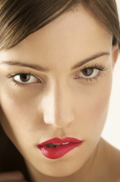 woman biting her lip - Stock Image - Everypixel