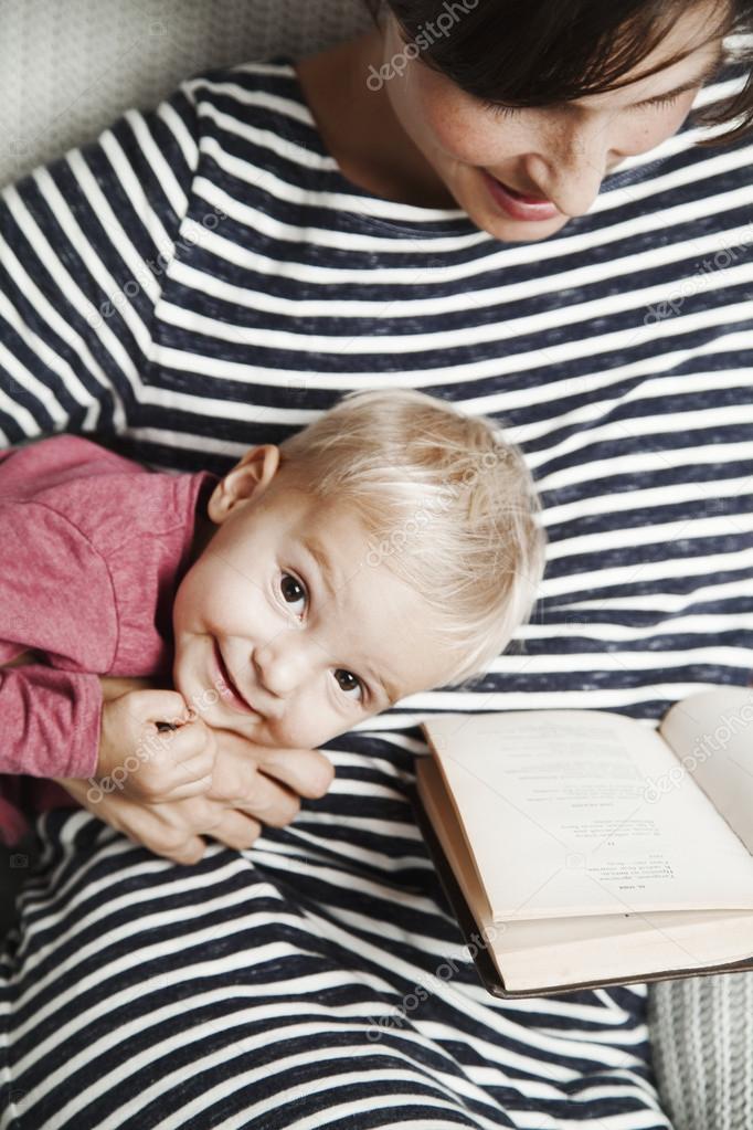 Child with mother are reading a book — Stock Photo © pogorelova #91599590