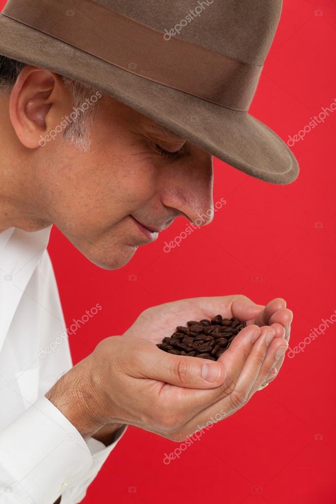 Man smelling coffee beans Stock Photo by ©carlosyudica 91013296