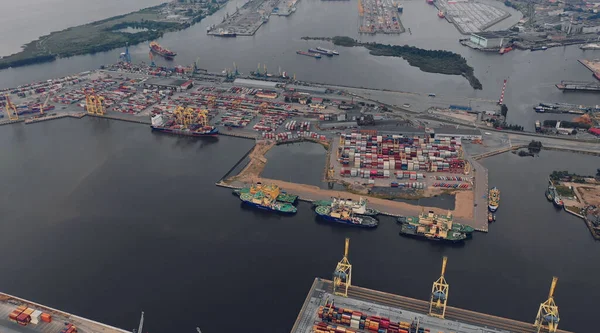Aerial view of high-tech modern seaport with cranes and loaders — Stock ...
