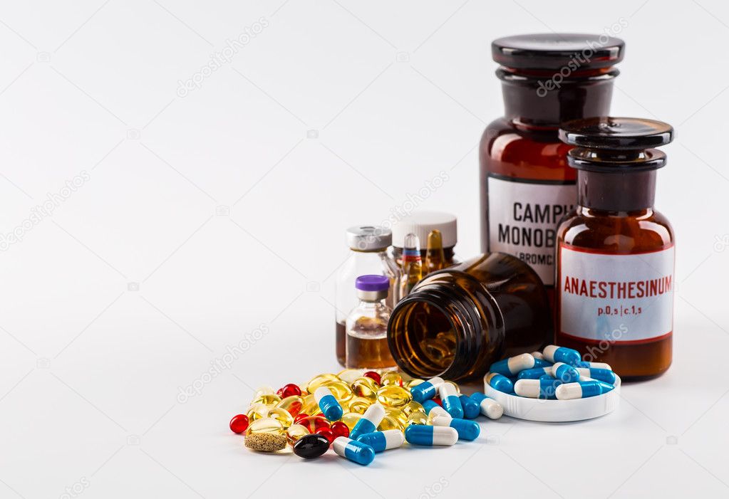 Medications tablets and capsules in a beaker Stock Photo by ©bukhta79 ...