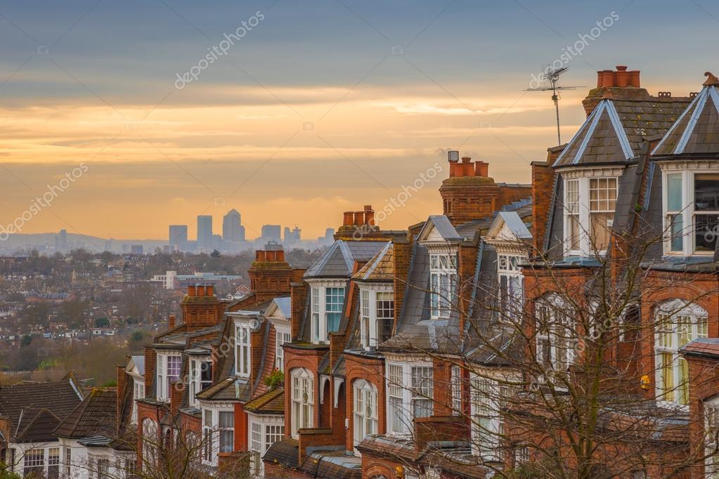 Typical British brick houses on a cloudy morning with sunrise and ...