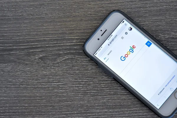 Apple iPhone 6s displaying the Google home page on the mobile browser ...