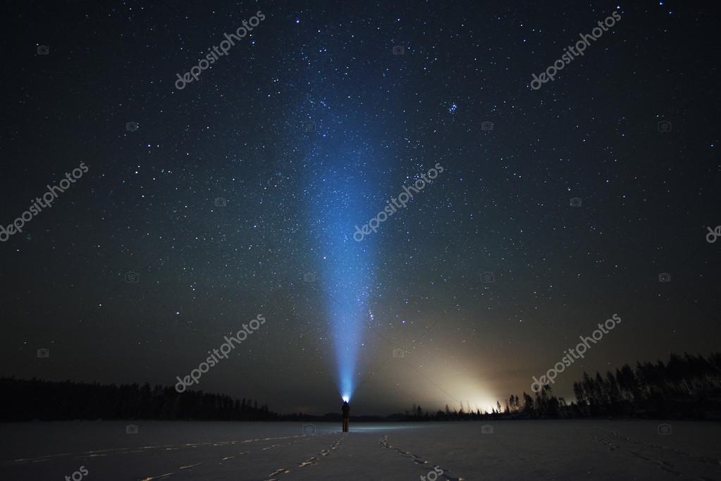 Blue ray of flashlight in the starry sky — Stock Photo © vkkspb.gmail ...