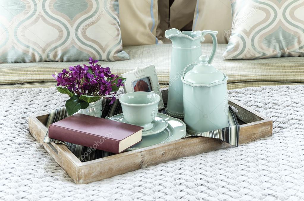 Decorative tray with book,tea set and flower on the bed — Stock Photo ...