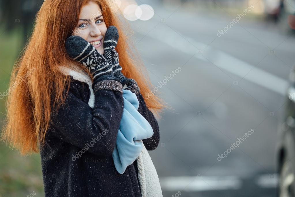 Red-haired girl standing on the street and laugh — Stock Photo ...