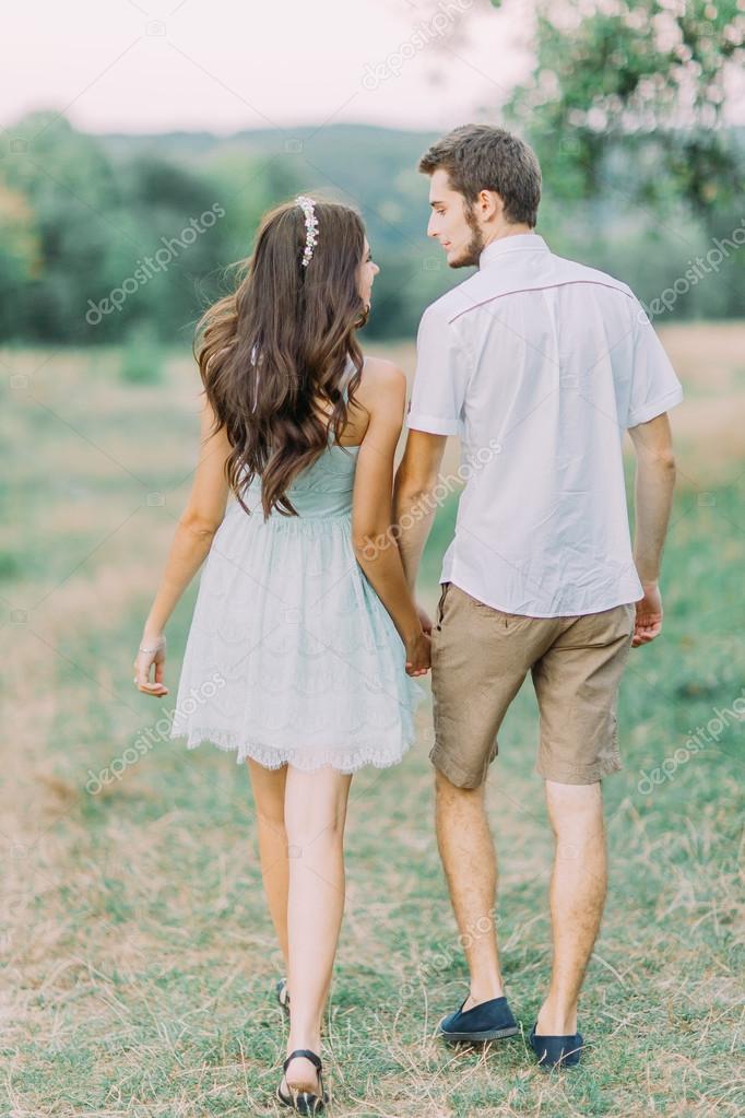 Cute Couple Holding Hands Walking