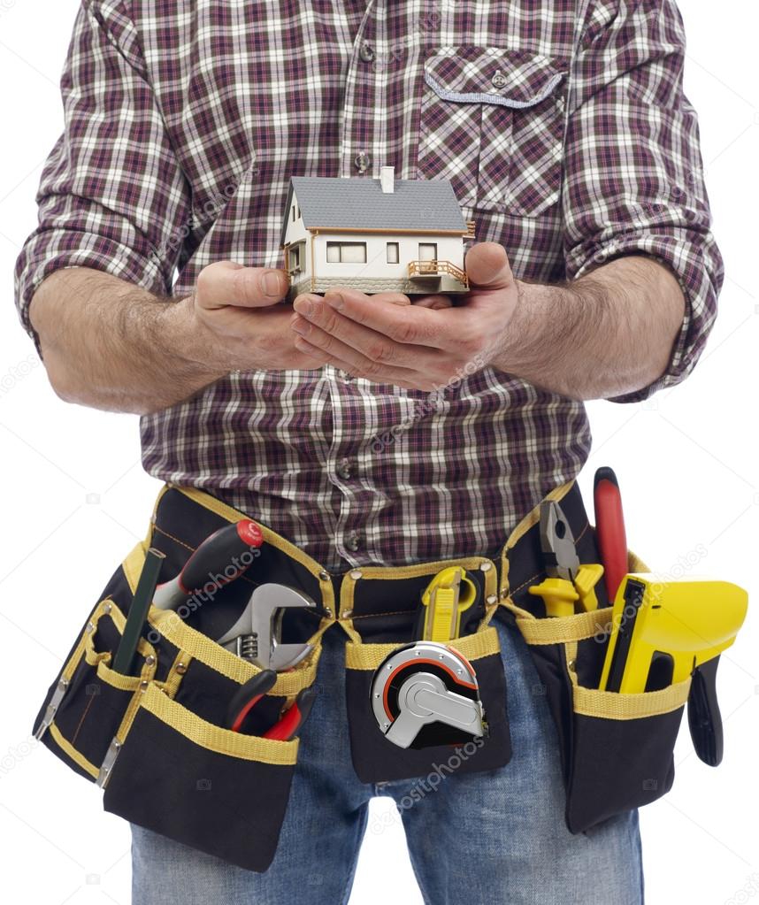 Carpenter showing a house model Stock Photo by ©Goir 104189154