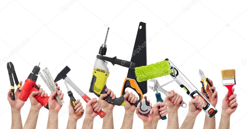 Hands holding tools Stock Photo by ©Goir 124015574