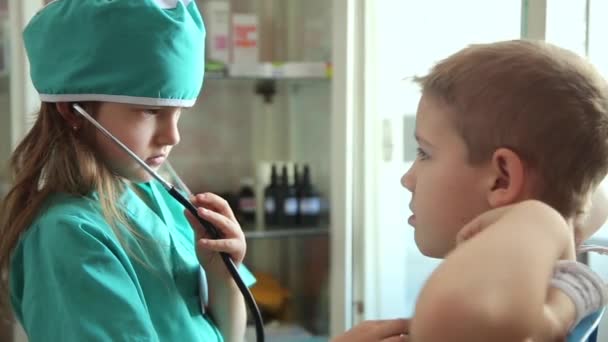 Boy and girl playing doctor and patient — Stock Video © alexandrsemenov ...