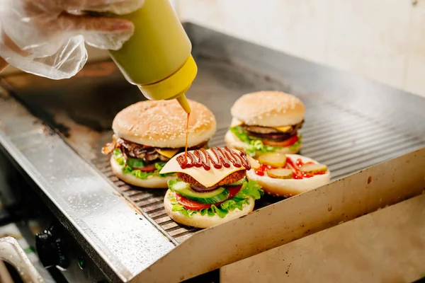 Burgers. The process of making burgers. The chef prepares burgers ...