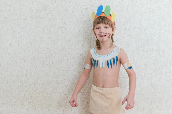 Blond boy playing injun Stock Photo by ©familylifestyle 109774188