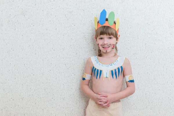 Blond boy playing injun Stock Photo by ©familylifestyle 109774188