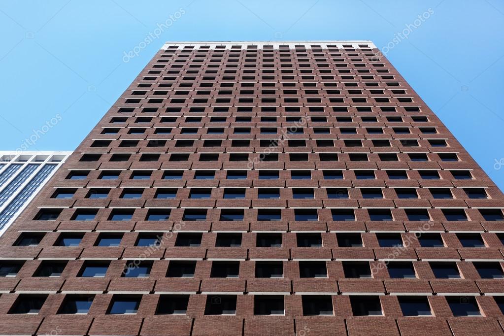 Tall brick building — Stock Photo © irkin09 #119979136 Tall brick building — Stock Photo © irkin09 #119979136