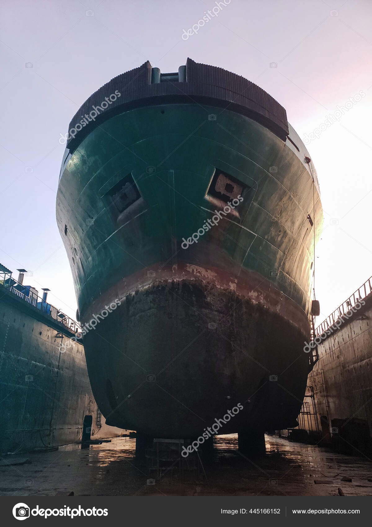 Industry view - Ocean Vessel in the dry dock in shipyard. Old rusty ...