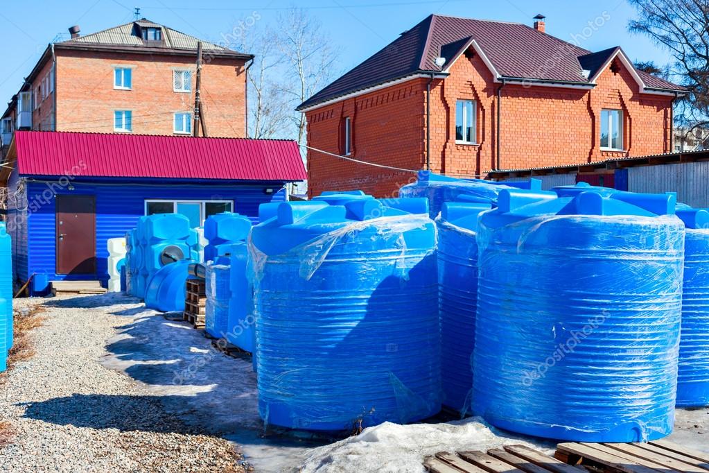 Blue plastic water tank — Stock Photo © Mukhomedianova #104716214