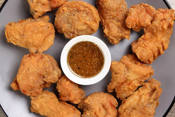 Light battered deep fried chicken variety mix pieces pile flaky meat on ...