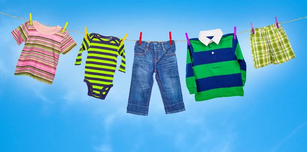 Laundry line with falling clothes on a white ⬇ Stock Photo, Image by ...