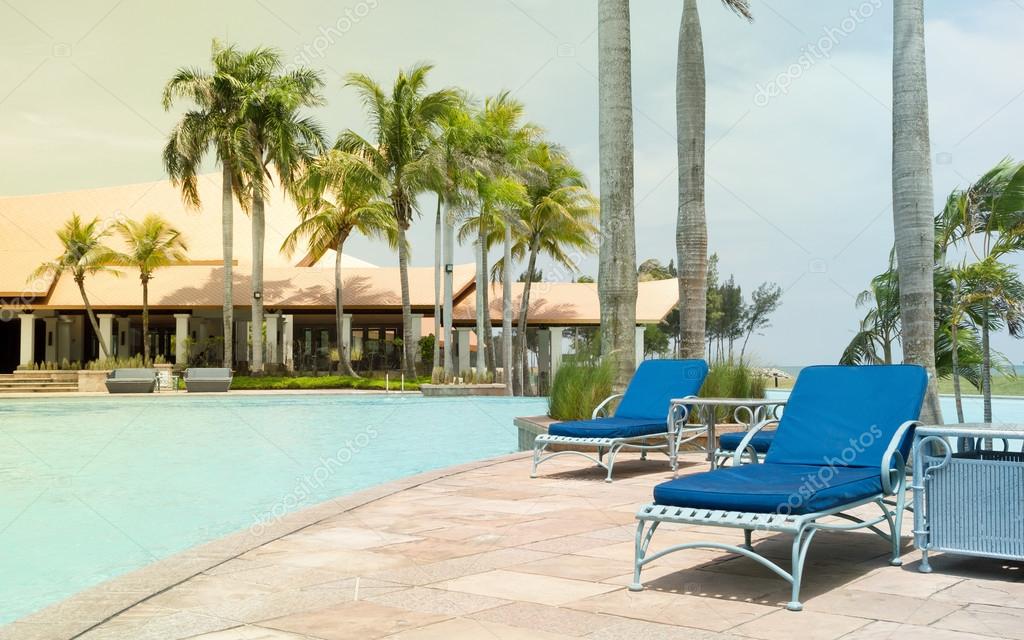 Luxury summer resort swimming pool Stock Photo by ©tostphoto 124645552